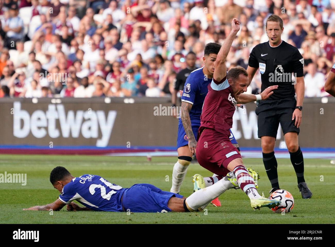 Chelsea's Levi Colwill, left, challenges for the ball with West Ham's ...