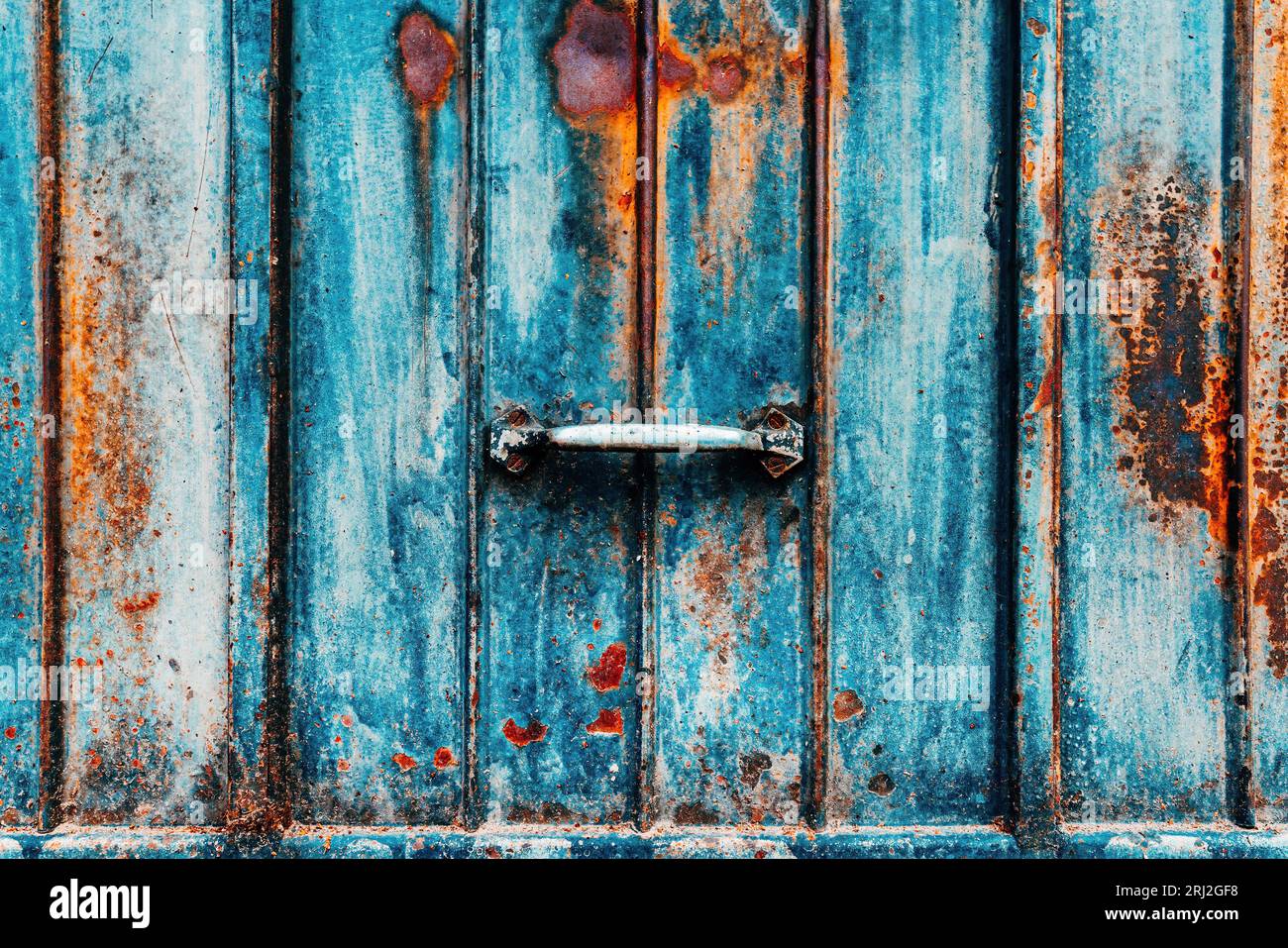 Old metal garage door handle, worn metallic surface as grunge texture ...