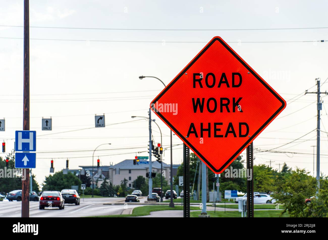 Road Work Ahead orange coloured board sign Stock Photo - Alamy