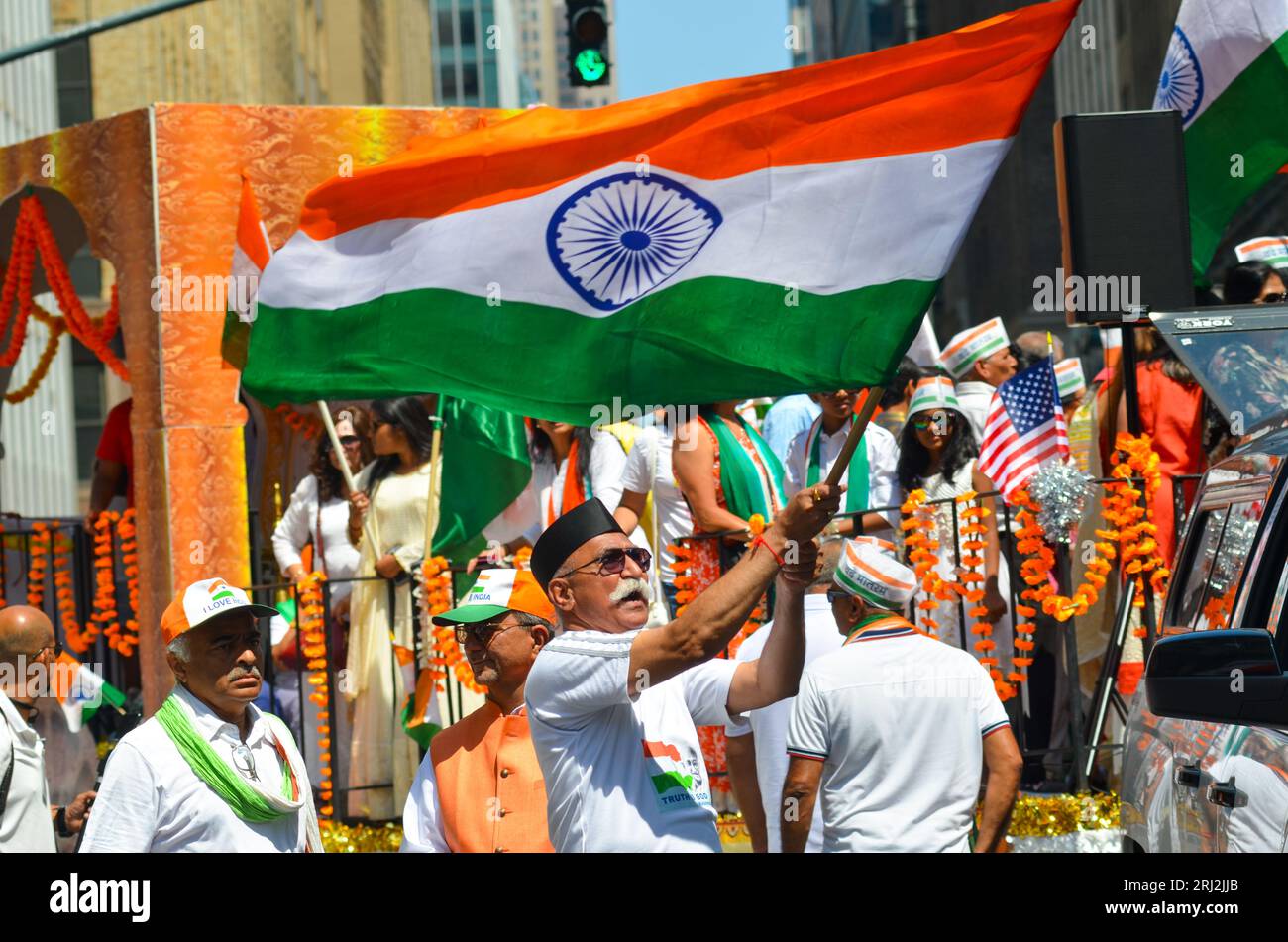 New York, United States. 20th August, 2023. Participants wave Indian ...