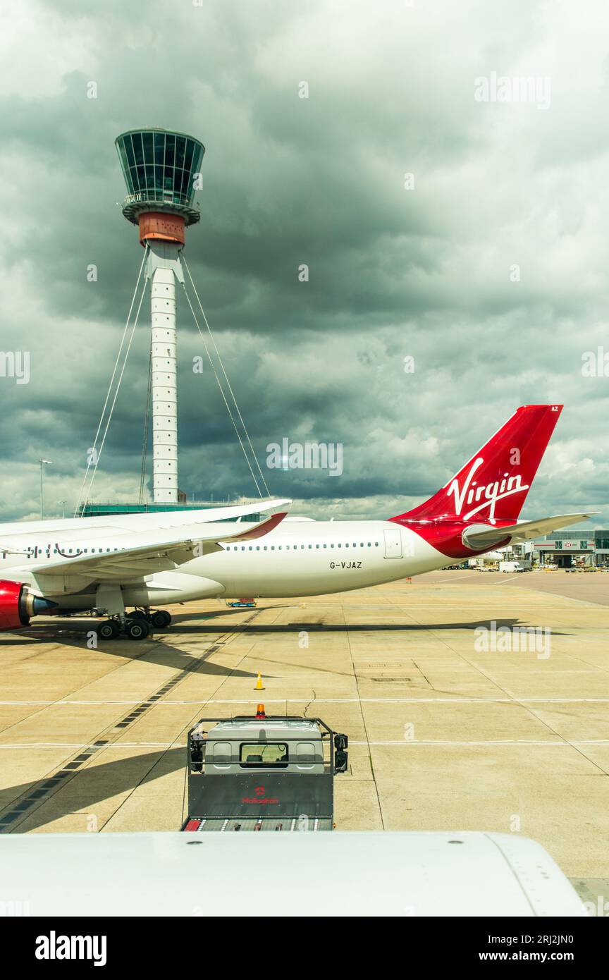 Virgin aircraft with Heathrow air traffic control tower at London ...