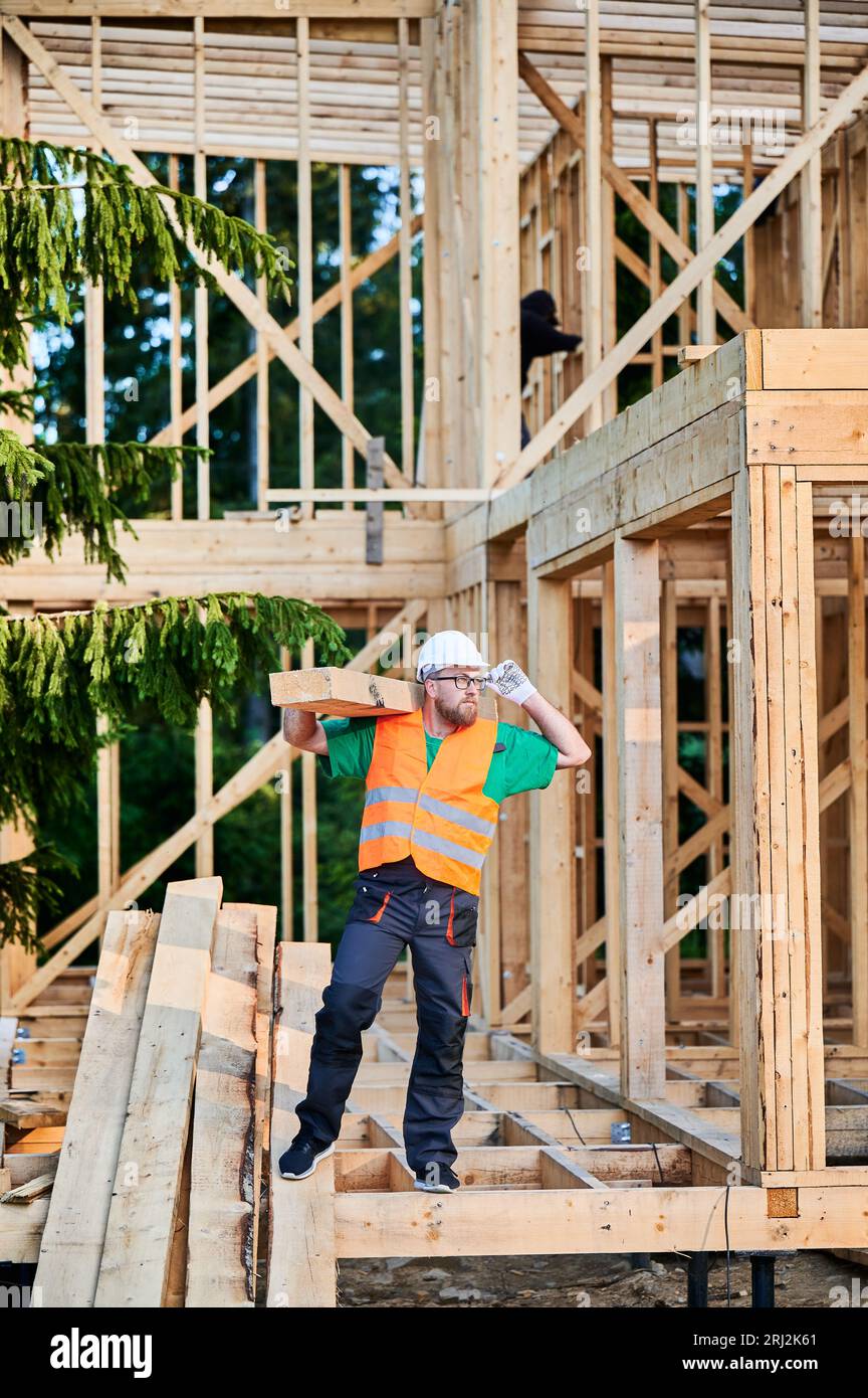 Construction lumber on shoulder hi-res stock photography and images - Alamy