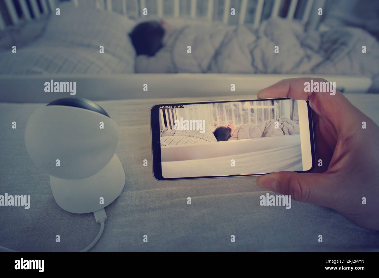 Monitoring from the phone through the camera for a child sleeping in ...