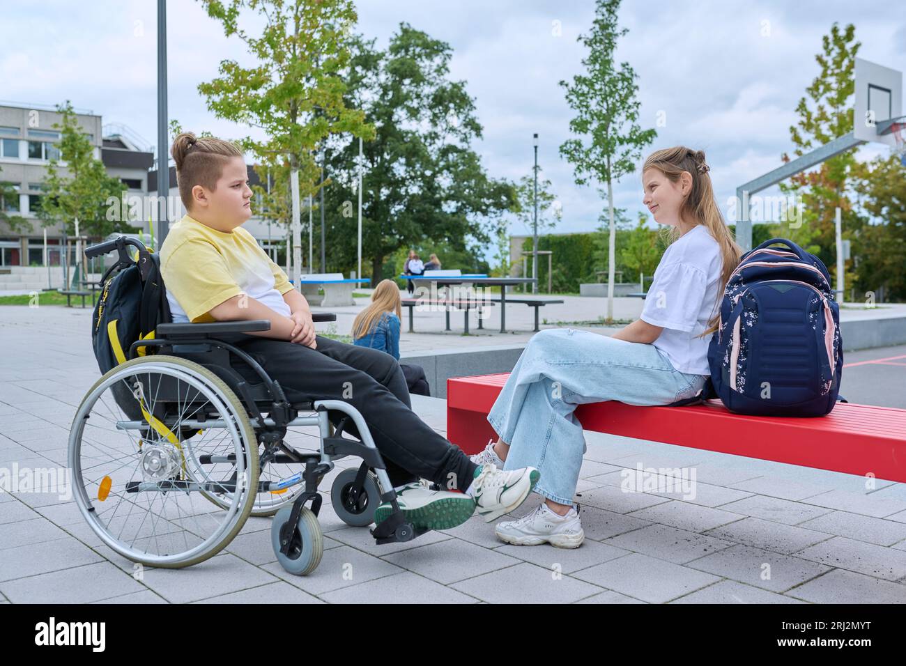 Friendship communication of children of disabled boy in wheelchair and ...