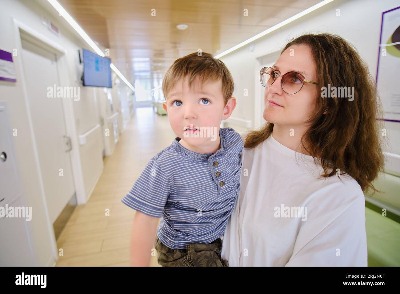 The child and his parent are waiting for their doctor's visit in the ...