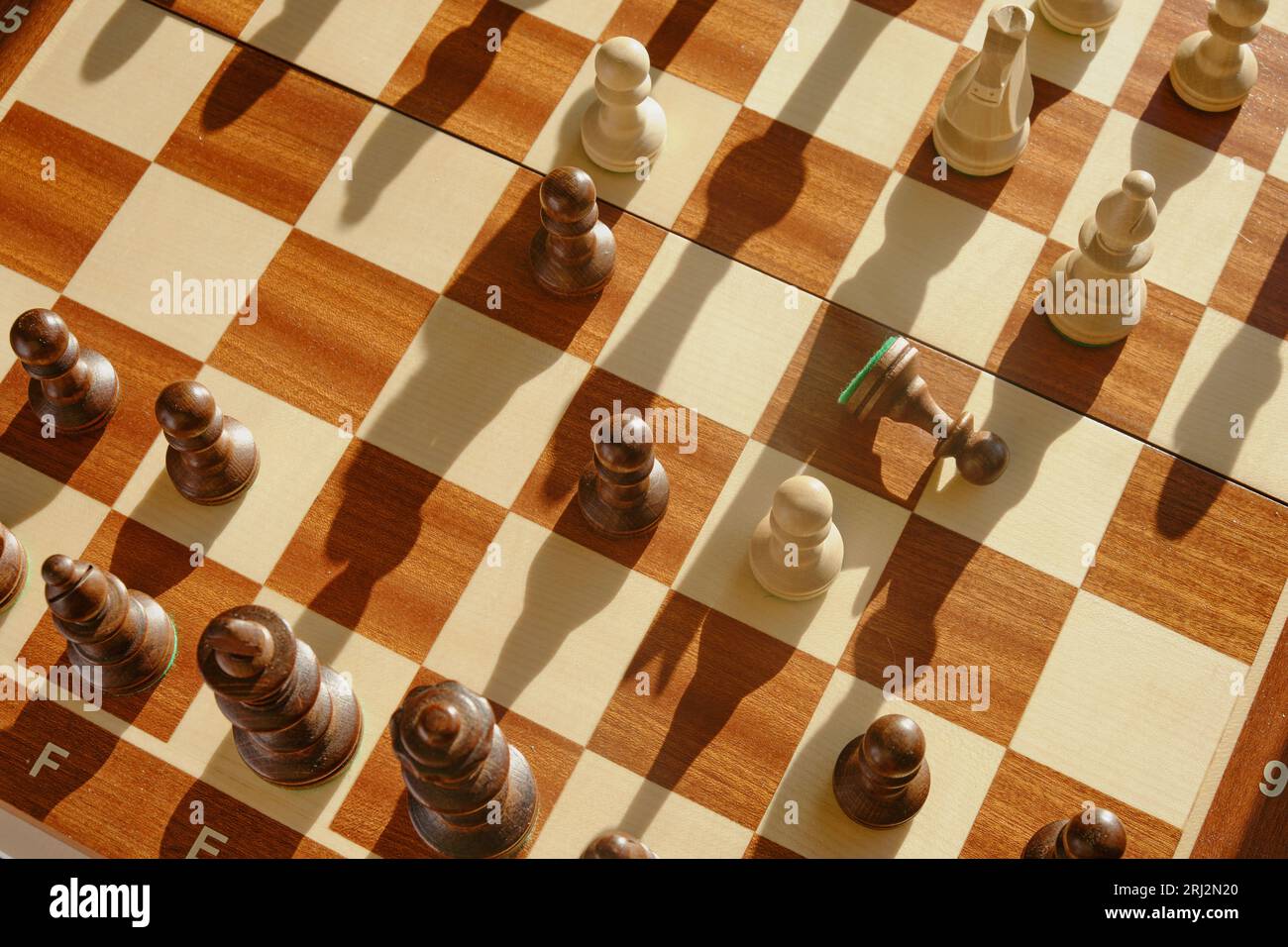 In chess, en passant the capture by a black pawn of an white enemy paw ...