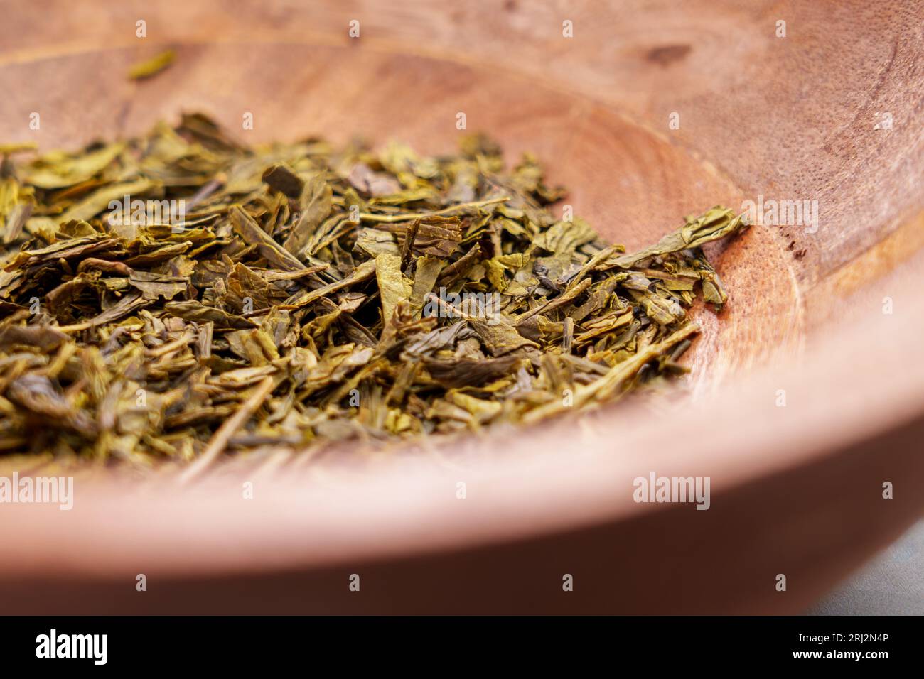 Sencha japanese dried green tea leaves in a wooden dish close up Stock ...