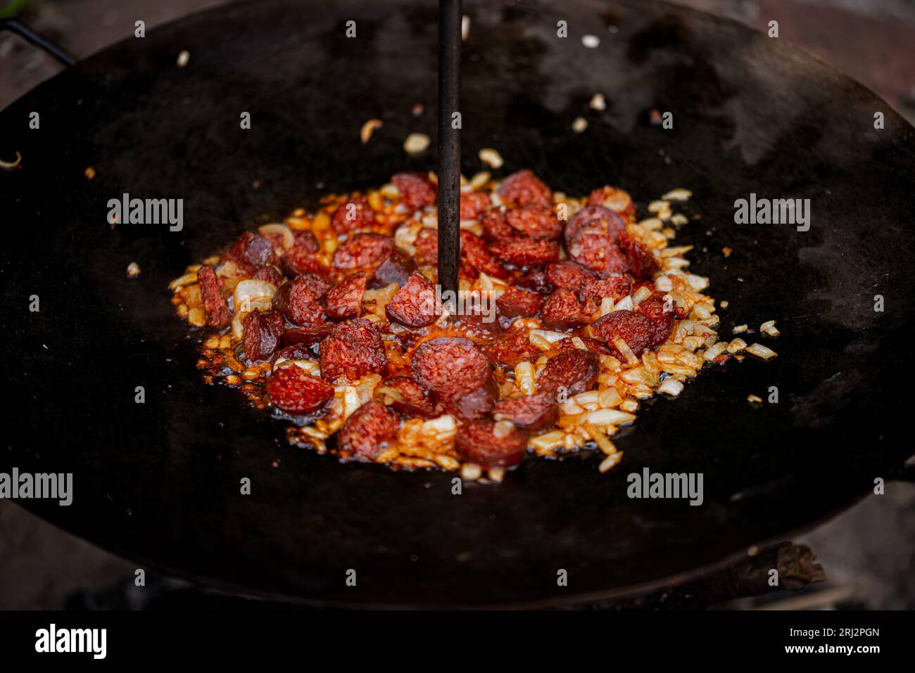 Letcho, stew with courgette and sausages. Cooking outdoors in the ...