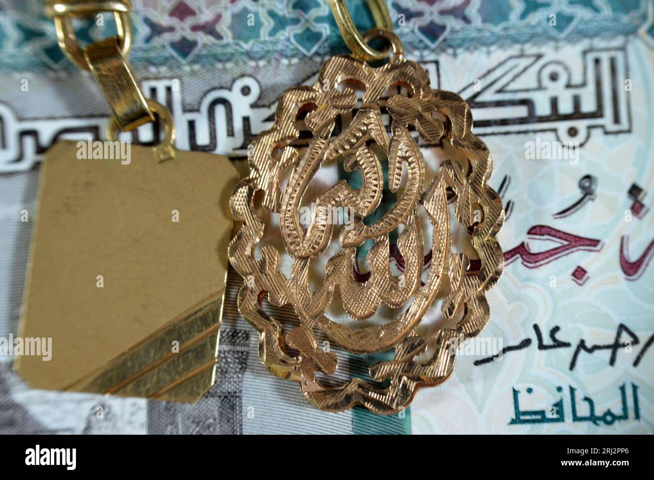 Background of gold karat 18 with an Islamic Arabic text Allahu Akbar ...
