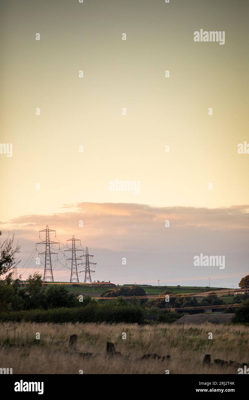 The sun sunsets over the fields and hills of Pennine West Yorkshire ...
