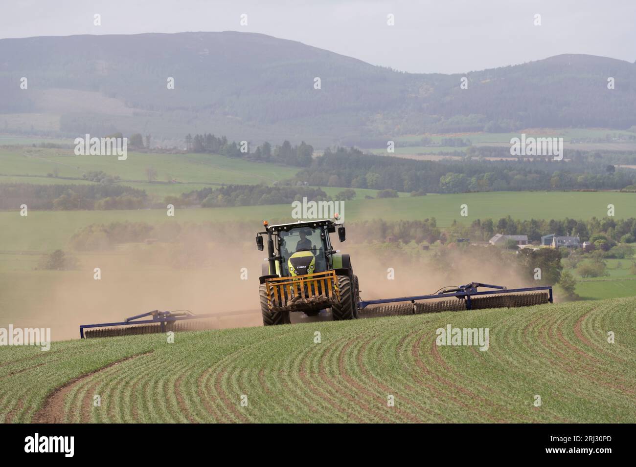 Front View of a Tractor Creating Clouds of Dust Rolling a Field of ...