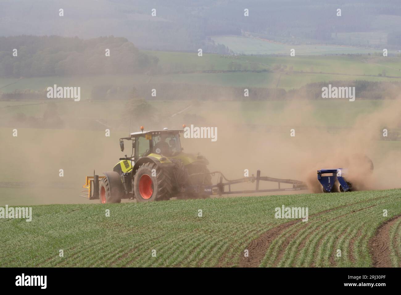 A Claas Axion 850 Tractor Towing Dalbo Powerroll 1530 Rollers Kicks Up ...