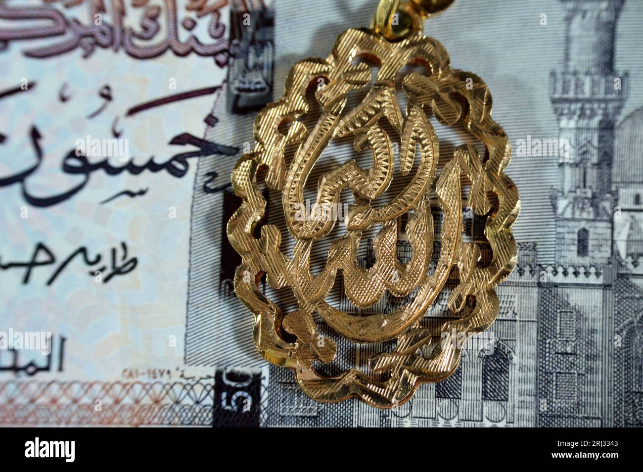 Background of gold karat 18 with an Islamic Arabic text Allahu Akbar ...