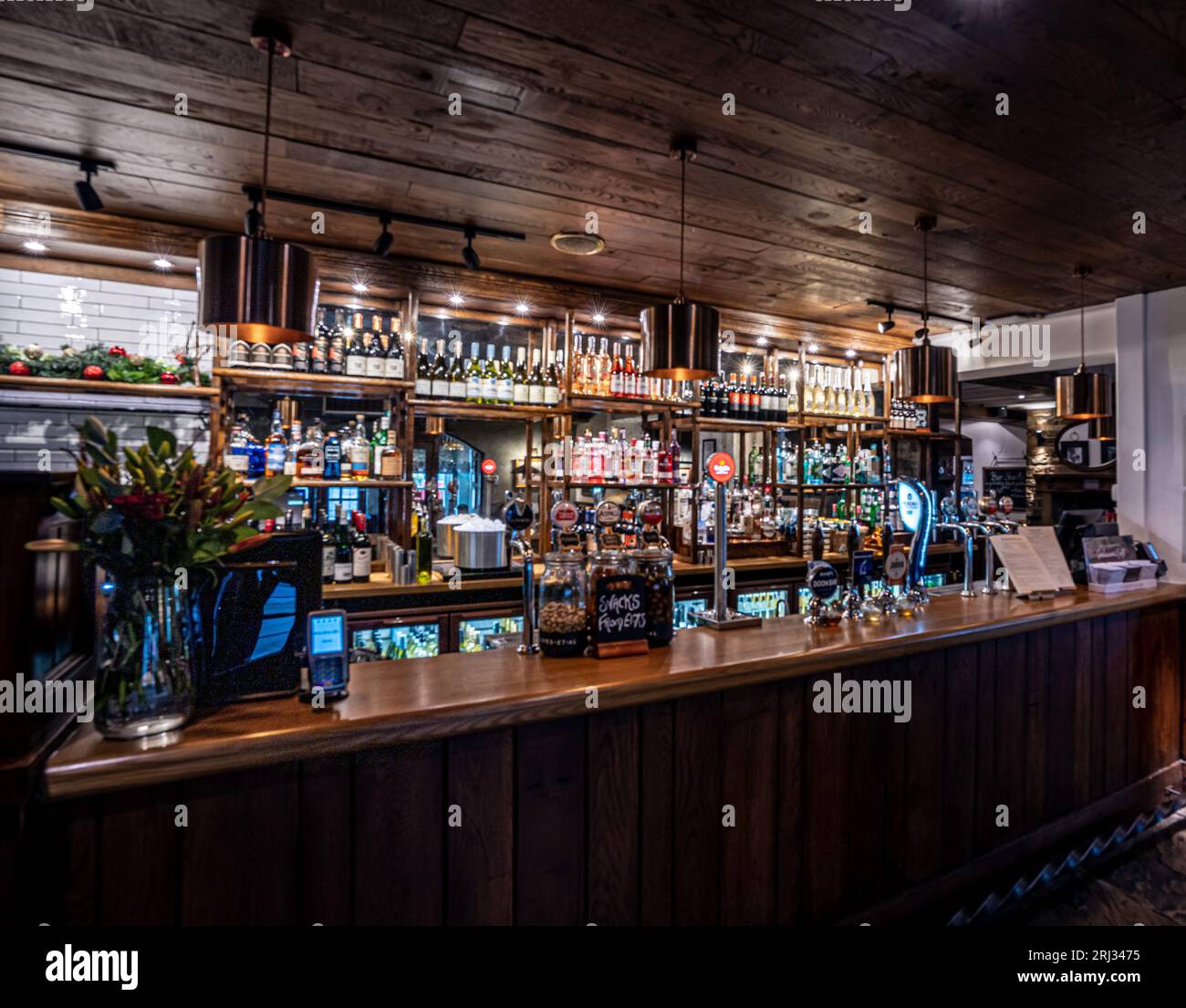 A selection of alcoholic drinks displayed in an organized manner on the ...