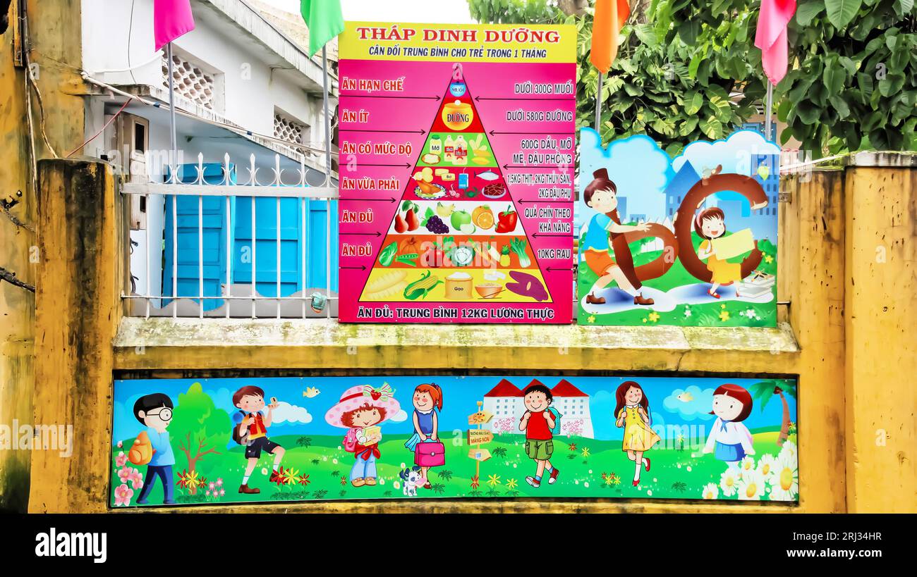 Hoi An, Vietnam - March 9. 2015: Vietnamese schoolyard wall with ...