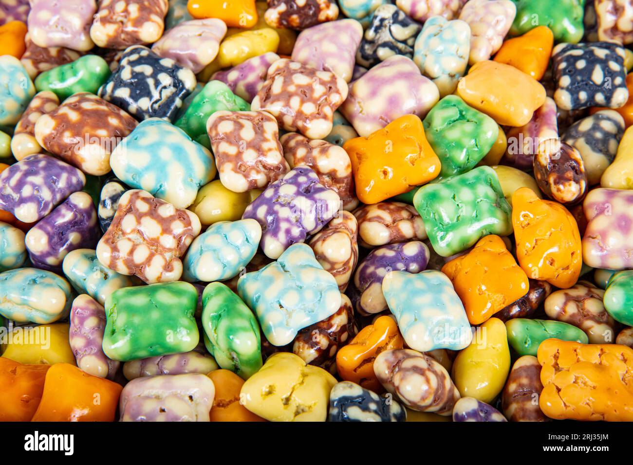 Milk chocolate candies in shell with jelly sugar gums and liquorice ...