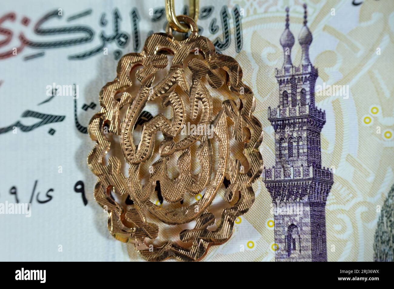 Background of gold karat 18 with an Islamic Arabic text Allahu Akbar ...