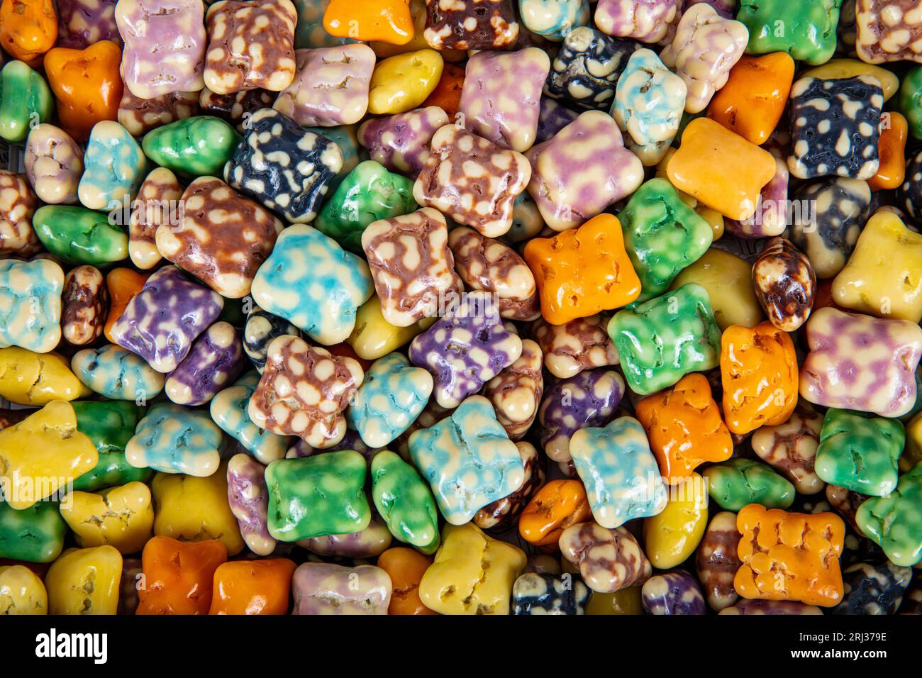 Milk chocolate candies in shell with jelly sugar gums and liquorice ...