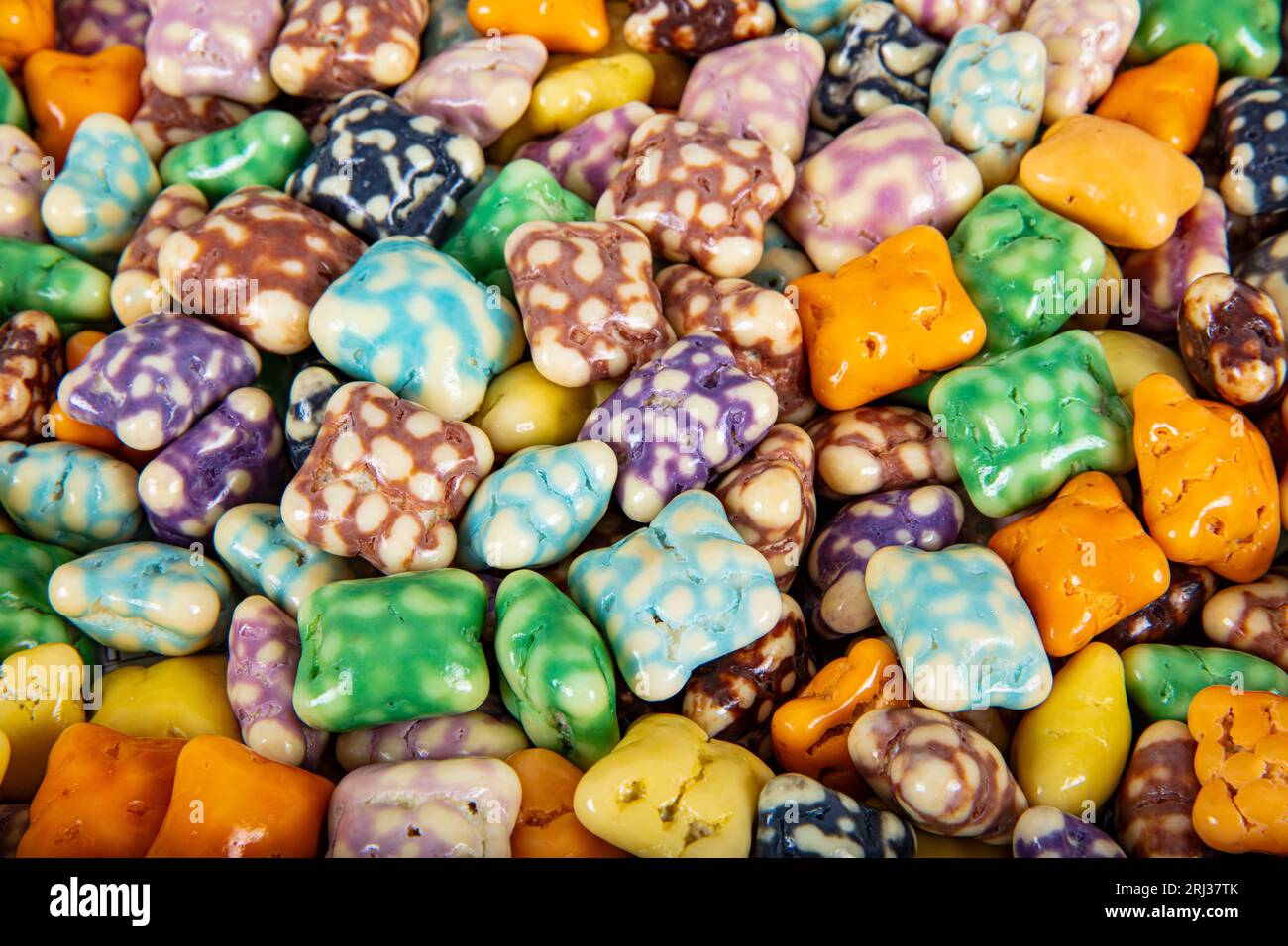 Milk chocolate candies in shell with jelly sugar gums and liquorice ...