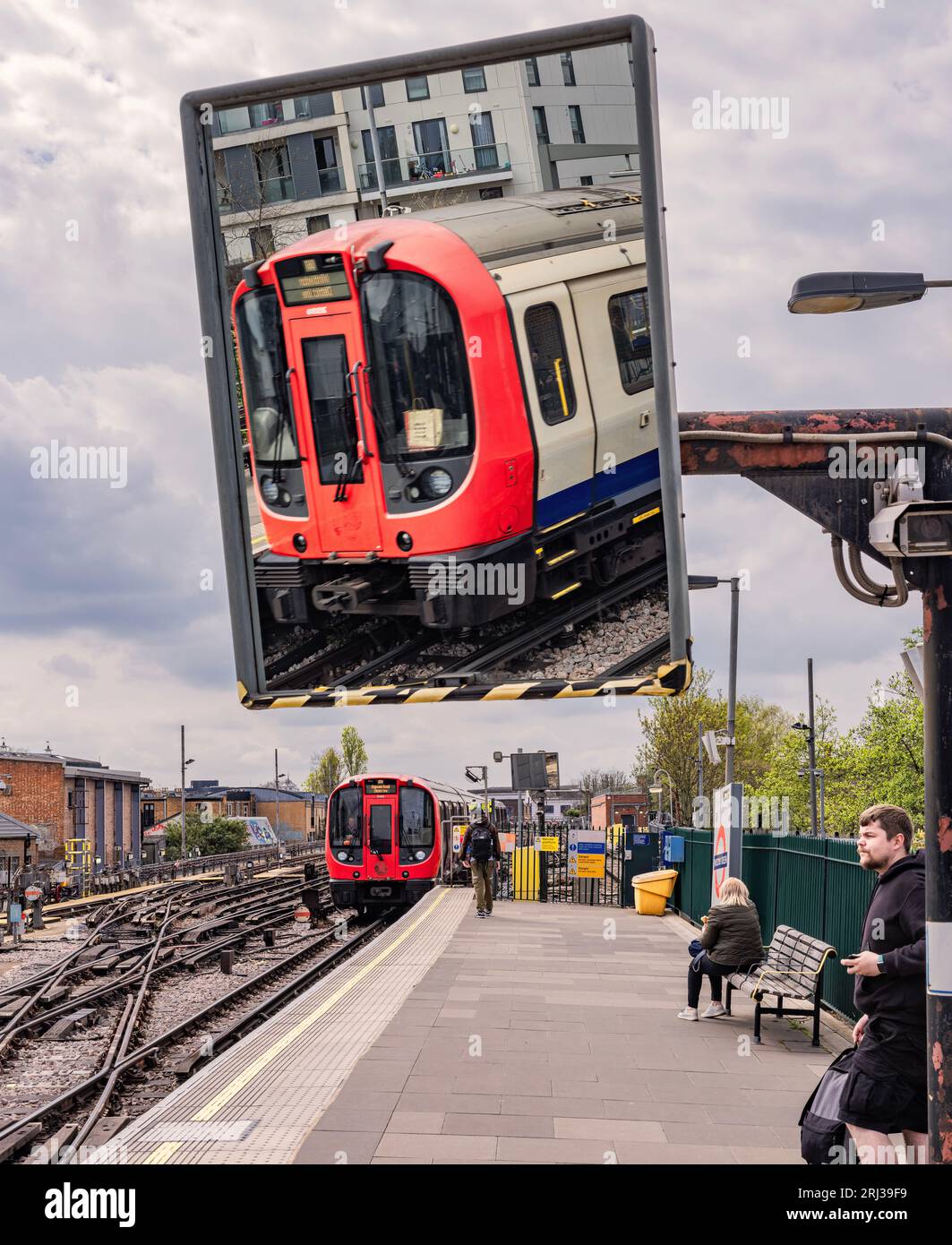 Parsons Green underground station showing a large mirror reflecting the ...