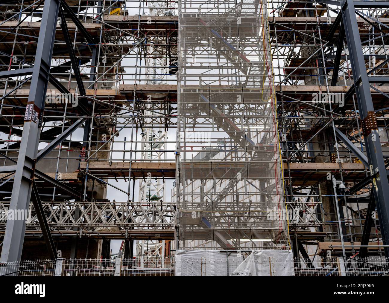 Scaffolding outside a large building project near Olympia, London Stock ...
