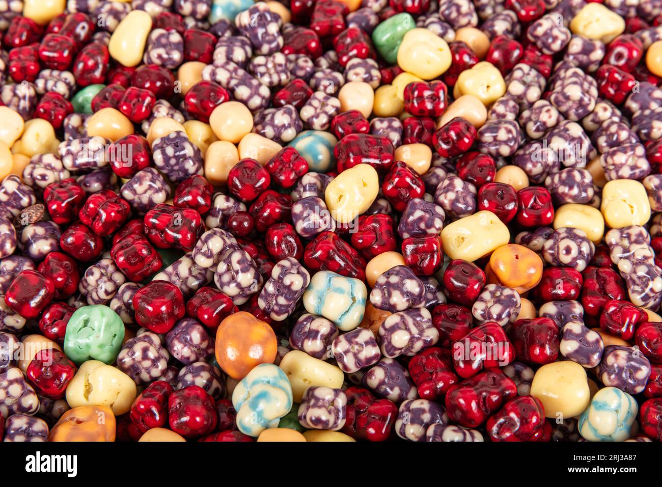 Milk chocolate candies in shell with jelly sugar gums and liquorice ...