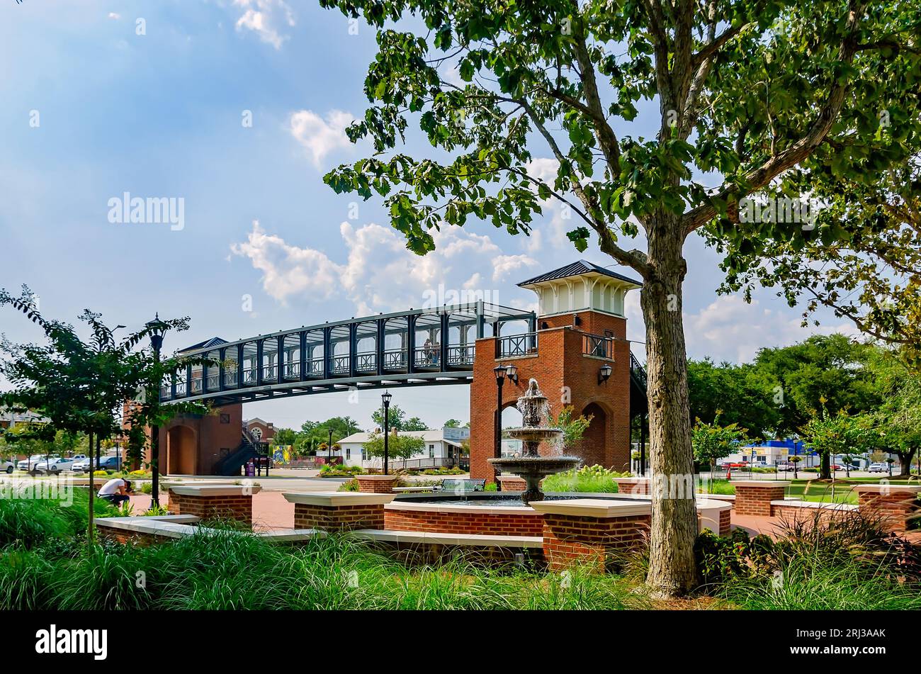 The pedestrian bridge and water fountain are pictured at John B. Foley ...