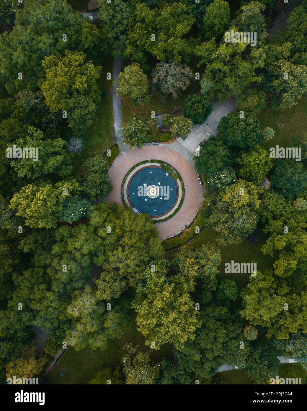 An aerial top view of a circular fountain in a green park Stock Photo ...