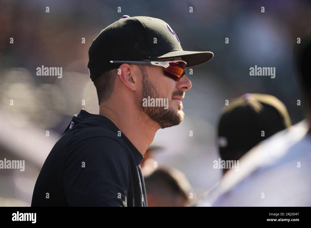Injured Colorado Rockies outfielder Kris Bryant looks on from the ...