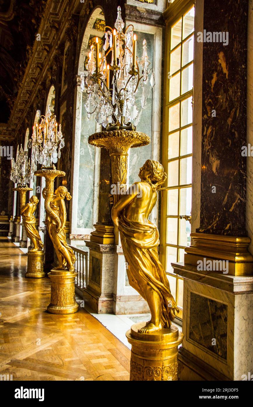 Three golden statues stand in a grand marble hall at the historic ...