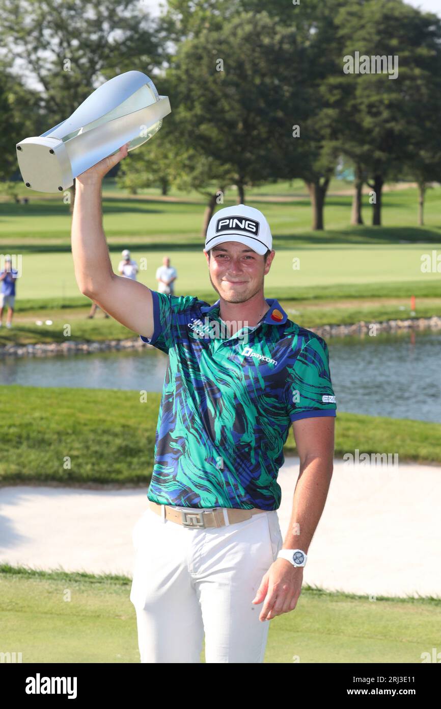 OLYMPIA FIELDS, IL - AUGUST 20: PGA golfer Viktor Hovland raises the BMW Championship Trophy ...