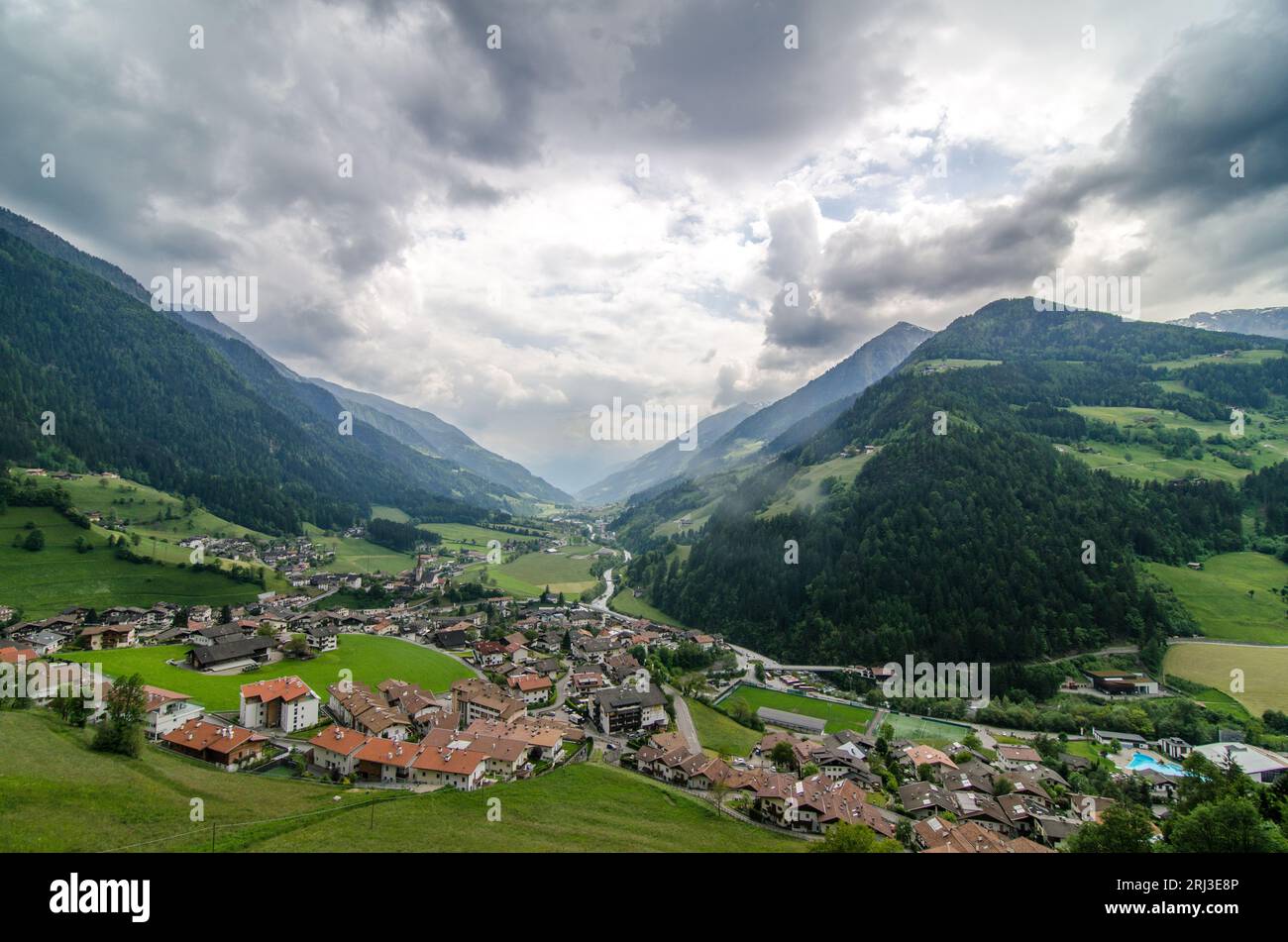 A stunning landscape photograph featuring an alpine village in the ...