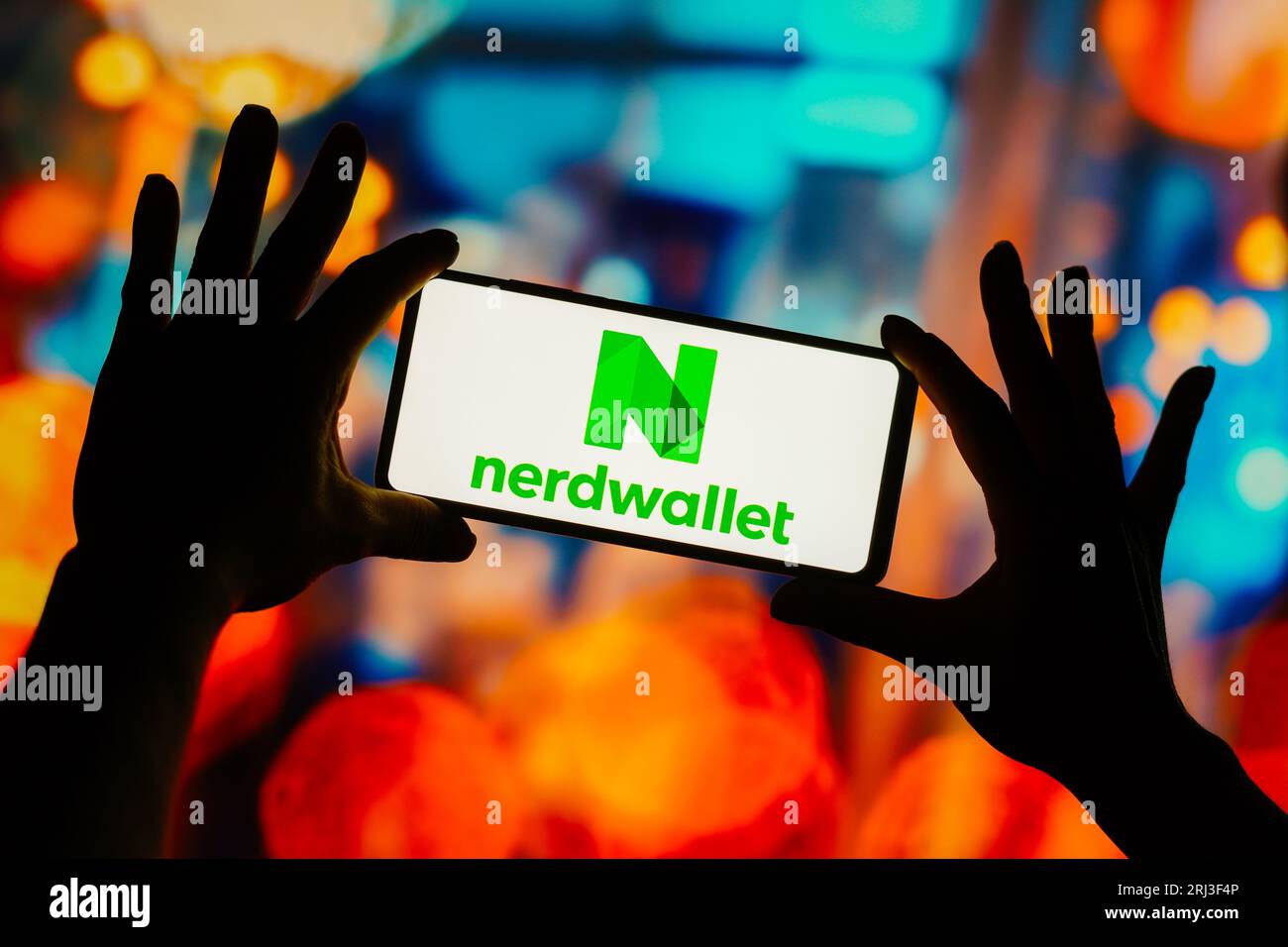 In this photo illustration, the NerdWallet logo seen displayed on a ...