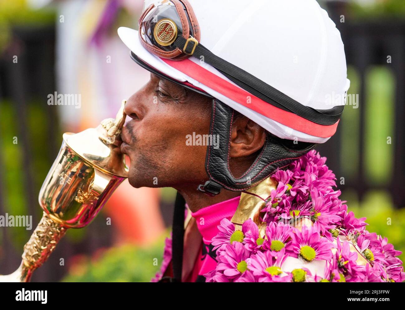Jockey Patrick Husbands kisses the trophy after winning the King's ...