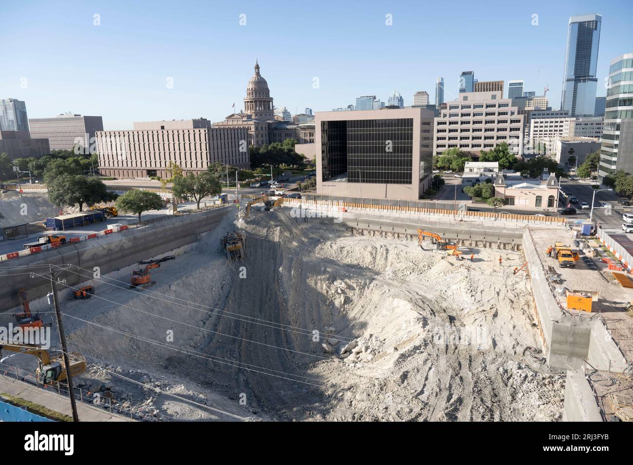 Texas construction crews work to dig foundations for two new five and ...
