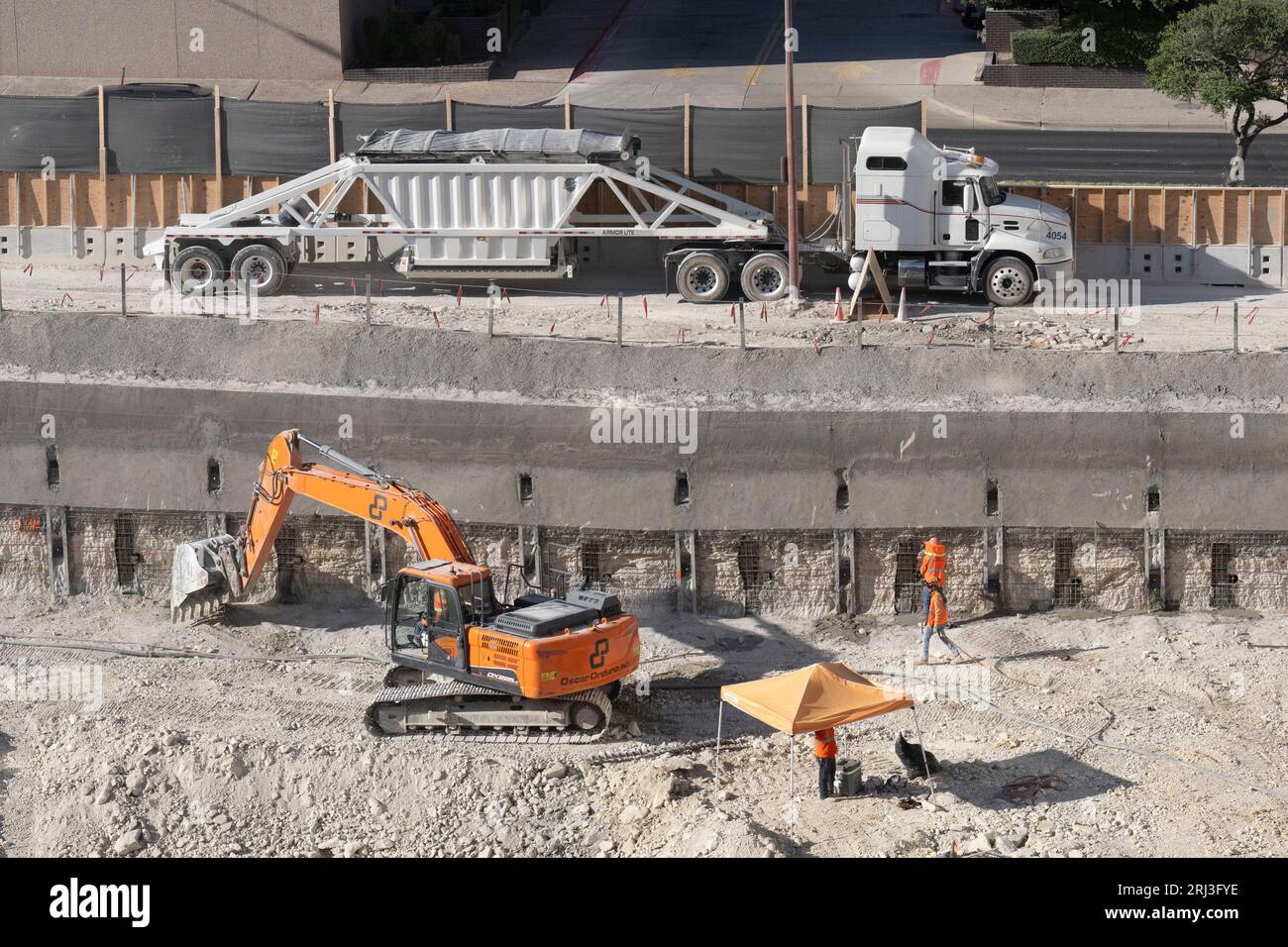 Texas construction crews work to dig foundations for two new five and ...