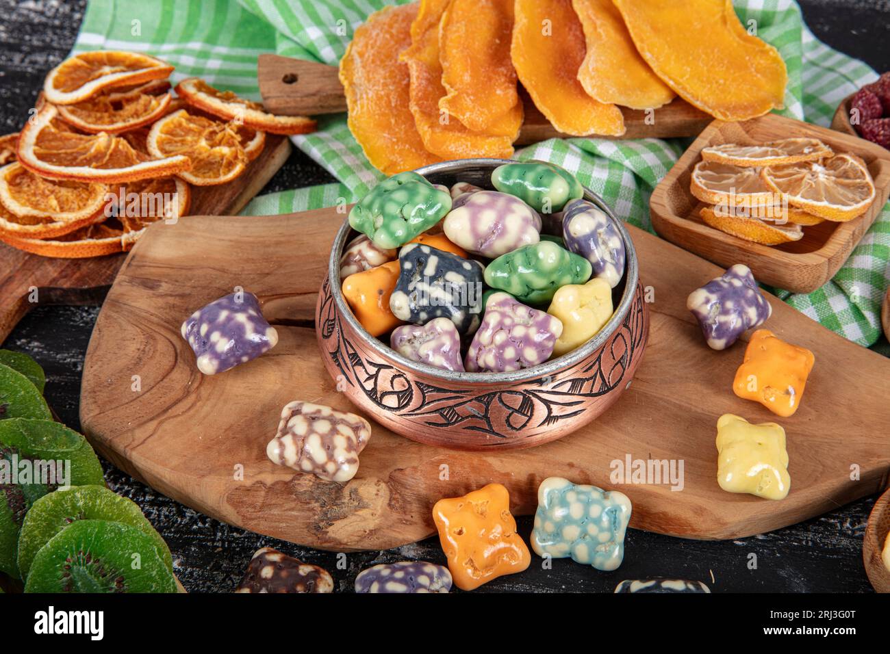 Milk chocolate candies in shell with jelly sugar gums and liquorice ...