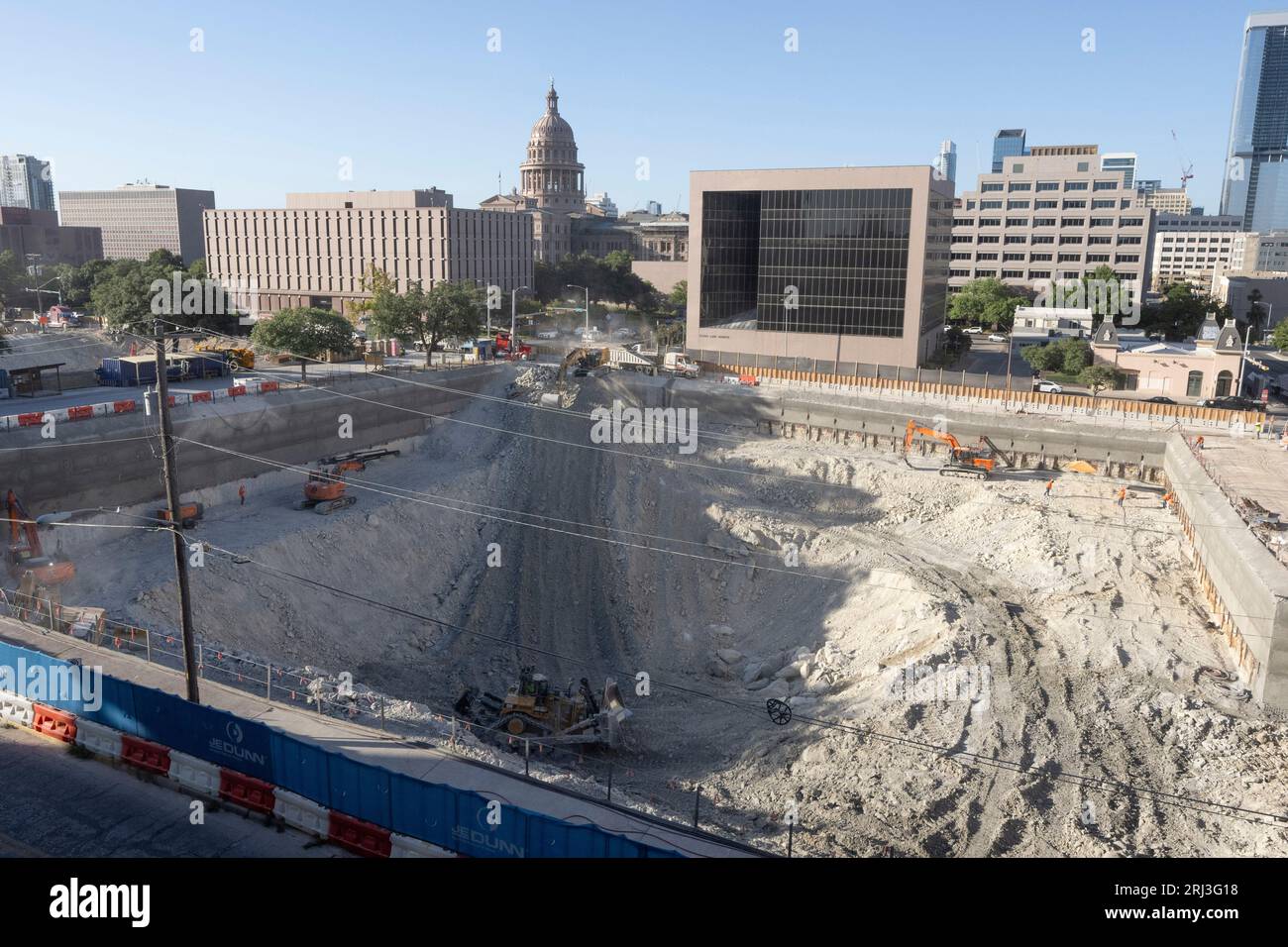 Texas construction crews work to dig foundations for two new five and ...