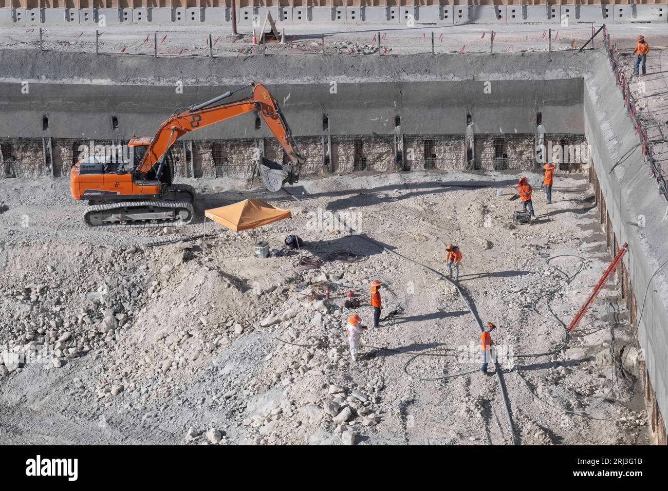 Texas construction crews work to dig foundations for two new five and ...