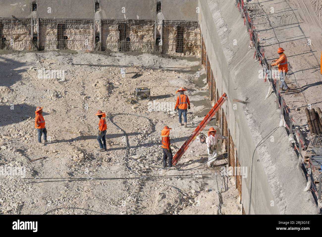 Texas construction crews work to dig foundations for two new five and ...