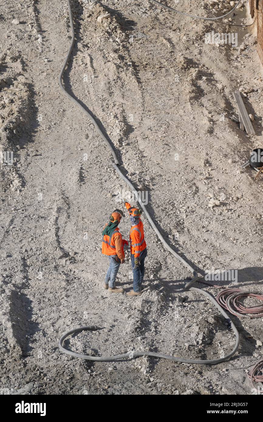 Texas construction crews work to dig foundations for two new five and ...
