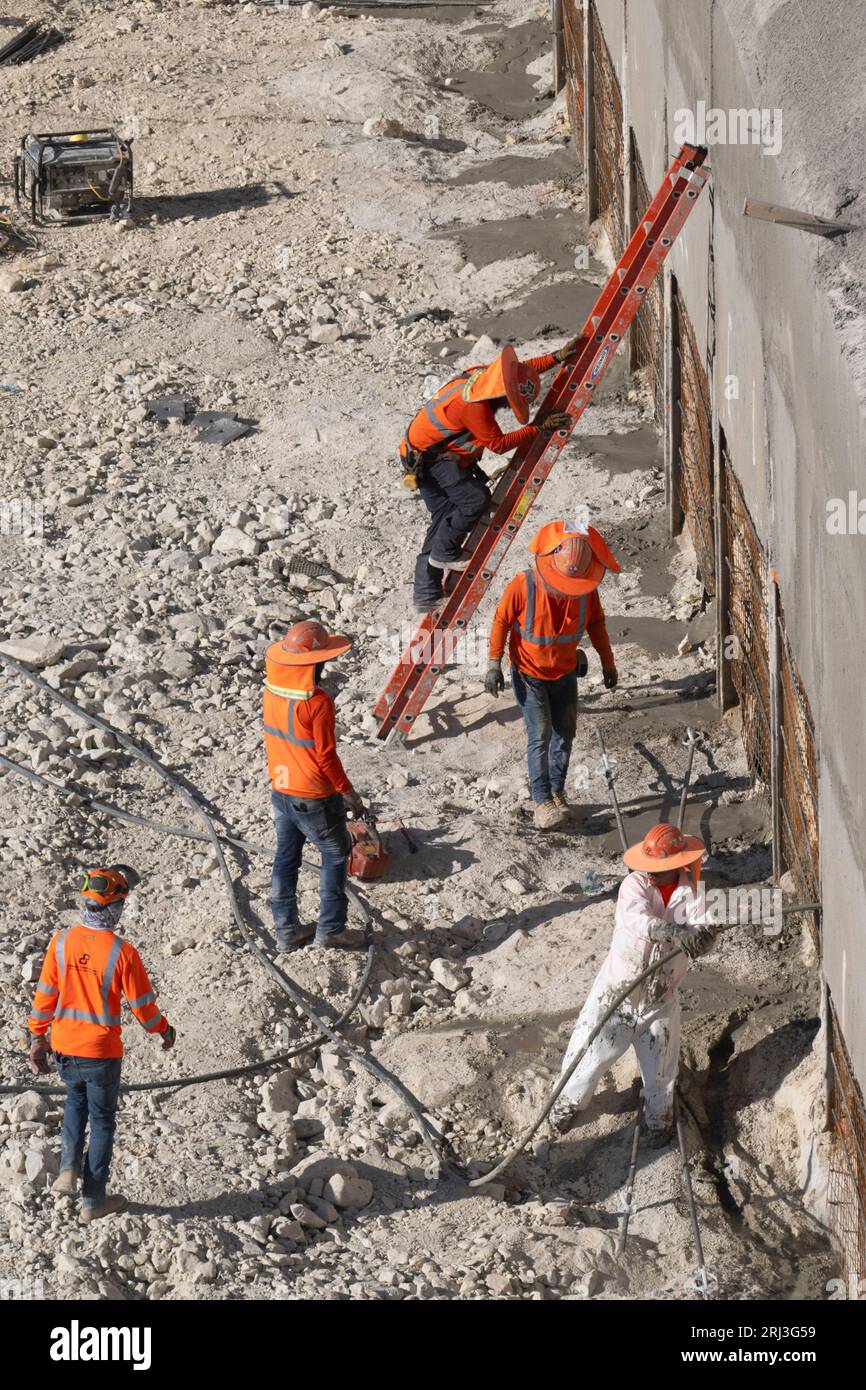 Texas construction crews work to dig foundations for two new five and ...