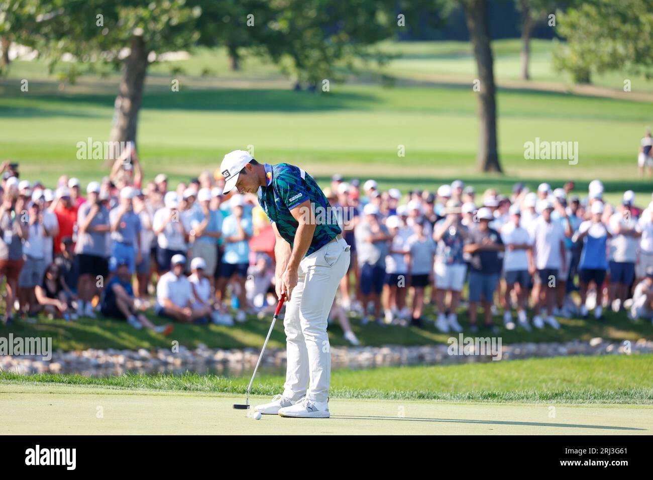 OLYMPIA FIELDS, IL - AUGUST 20: PGA golfer Viktor Hovland makes a birdie putt on the 18th hole ...
