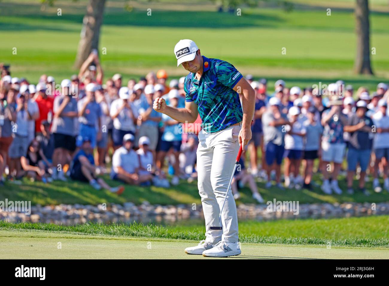 OLYMPIA FIELDS, IL - AUGUST 20: PGA golfer Viktor Hovland reacts to making a birdie putt on the ...