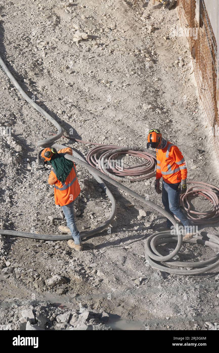 Texas construction crews work to dig foundations for two new five and ...