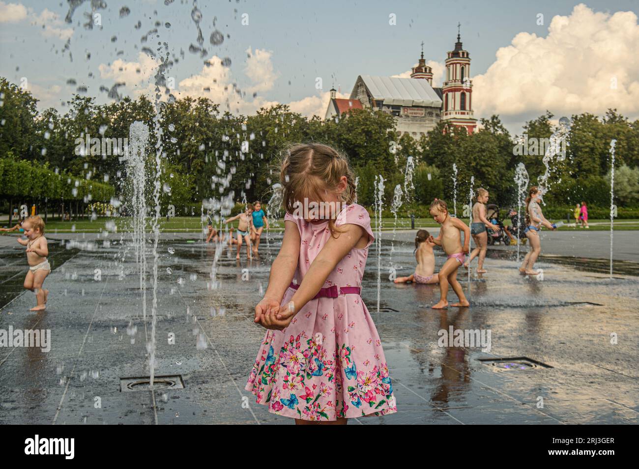 Vilnius, Lithuania. 20th Aug, 2023. Children cool off in a public ...