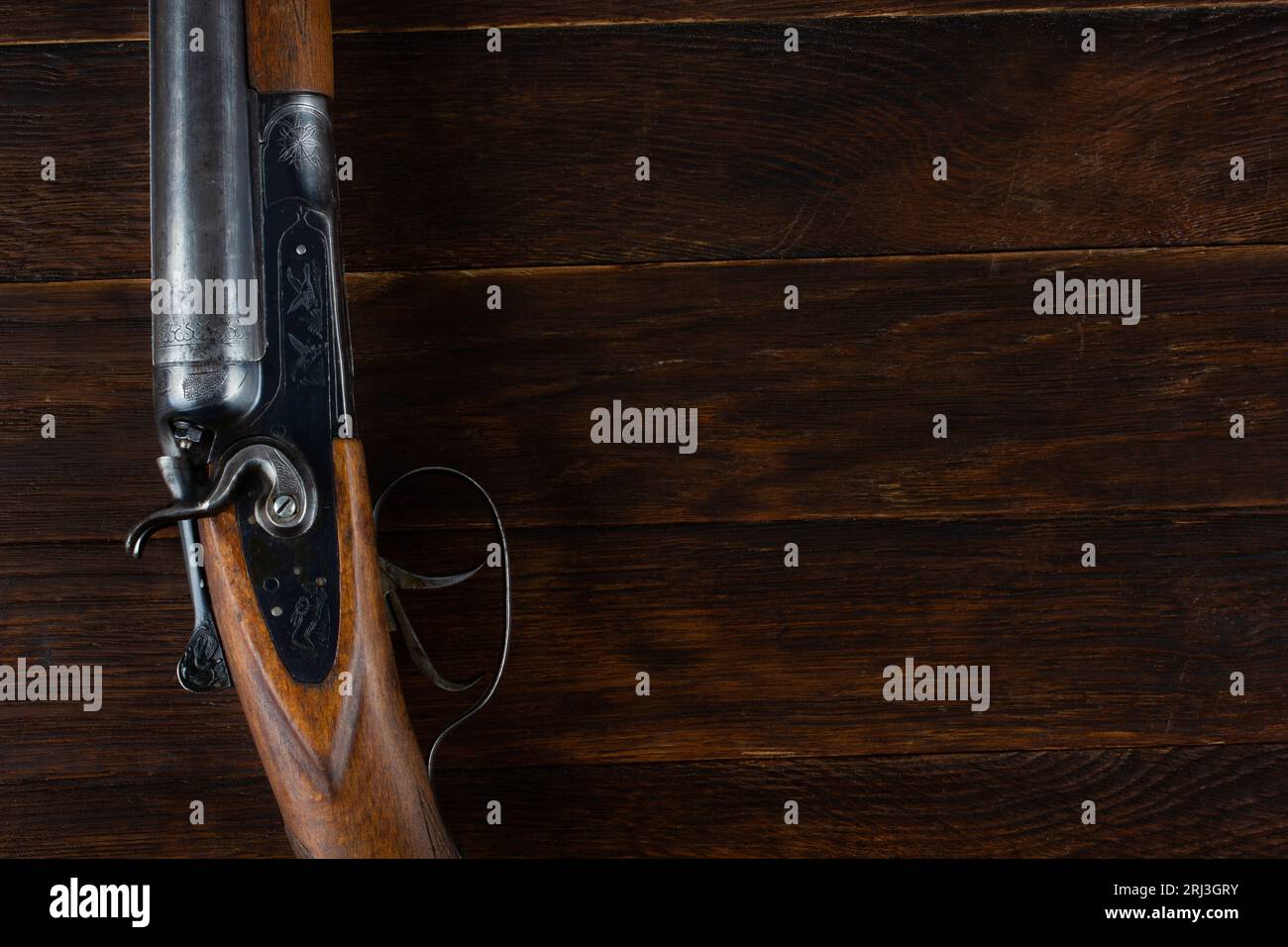 Antique 12-gauge break-action smooth-bored shotgun with paper cases on ...