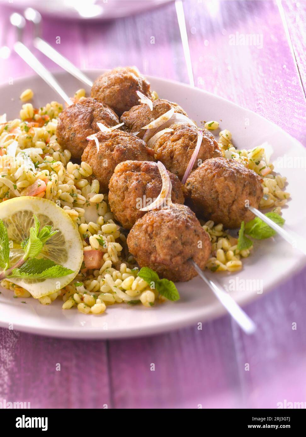Lamb kofta with and Ebly and mint salad Stock Photo - Alamy