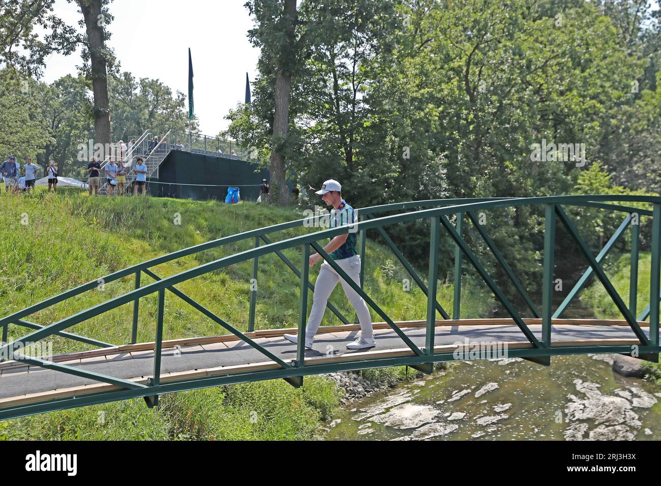 OLYMPIA FIELDS, IL - AUGUST 20: PGA golfer Viktor Hovland walks across a bridge to the 7th tee ...