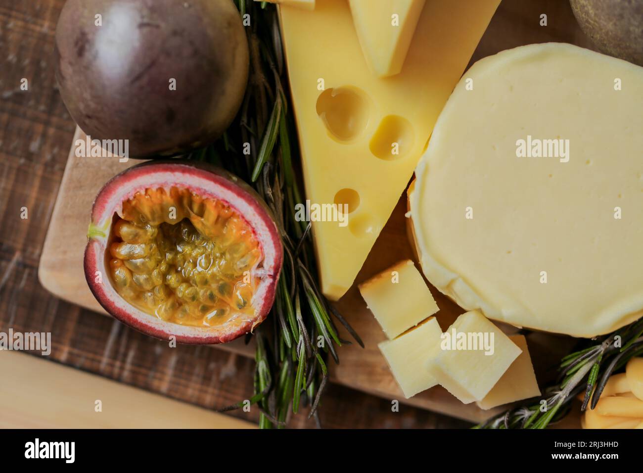 Cheese platter with fruits.Cheese board. assorted cheese on a wooden ...
